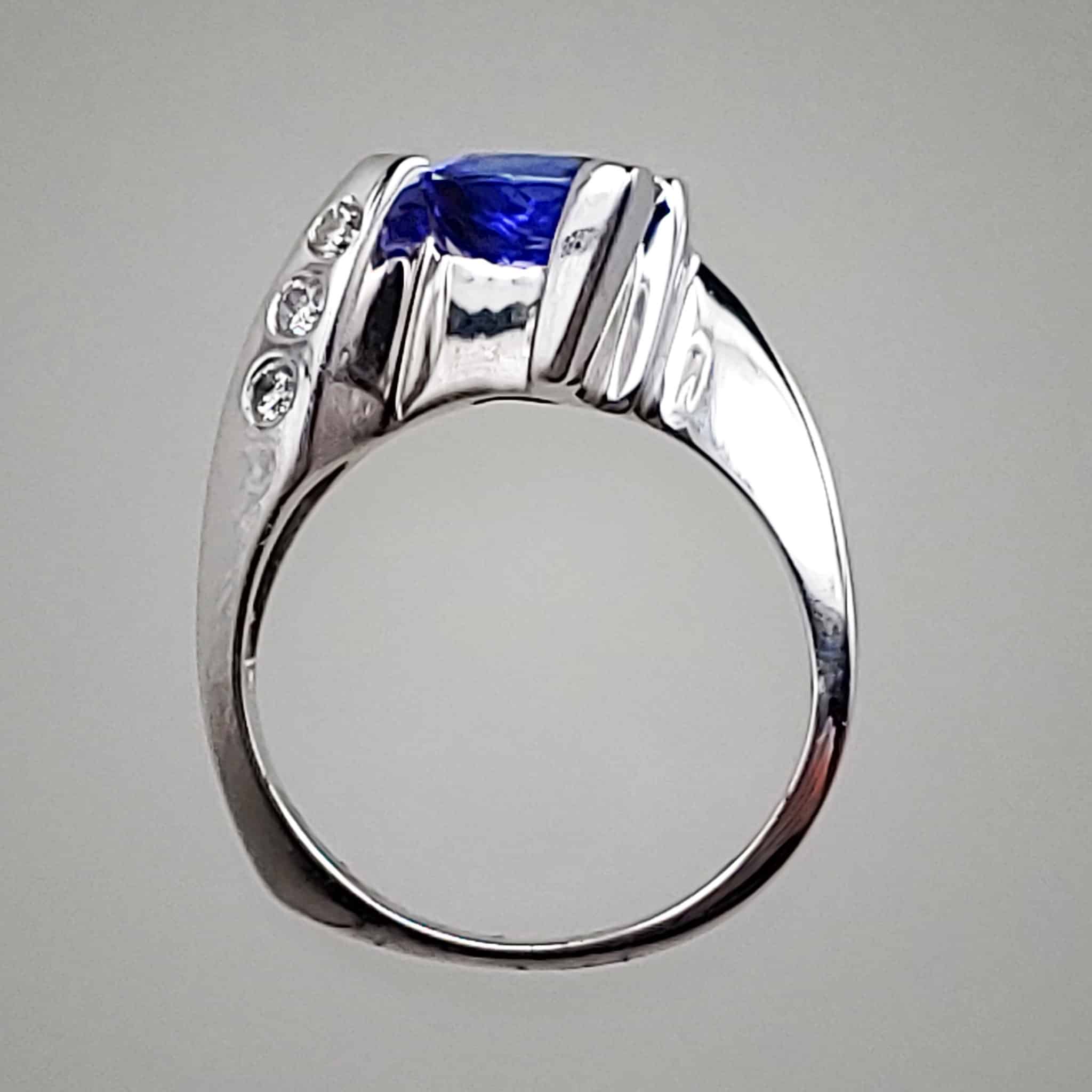 Trillion-Cut Tanzanite w Curved White Gold Shank w V-Prong Setting ...